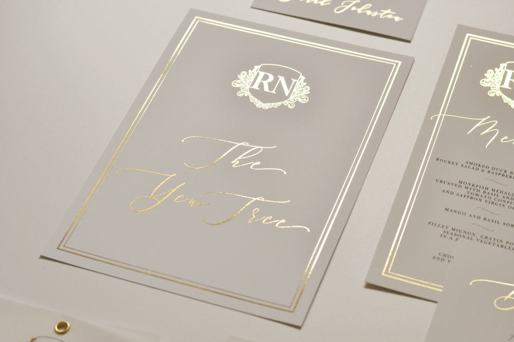 gold foiled and vinyl wedding stationery